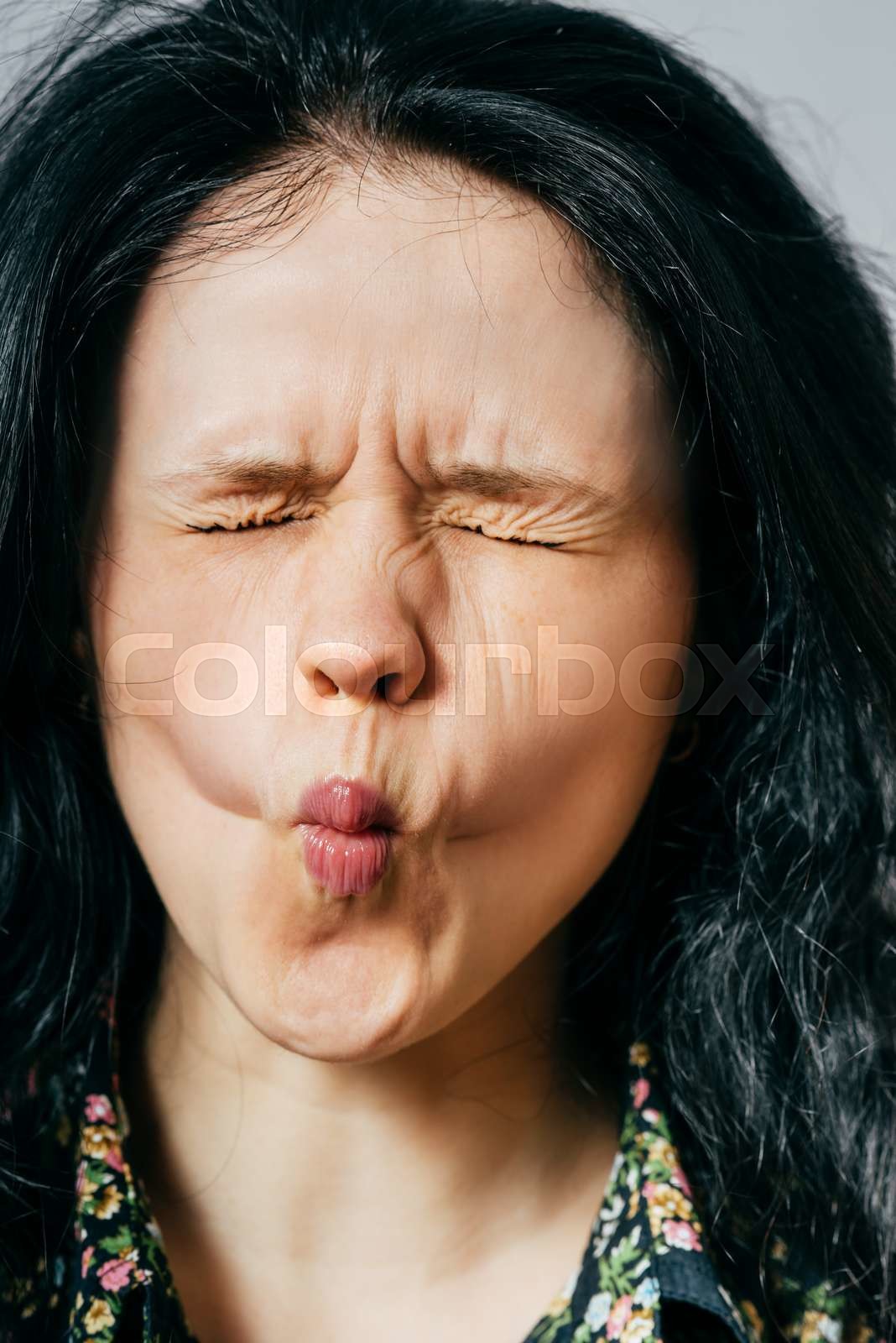 Headshot Portrait Of Beautiful Women Sucking In Cheeks Stock Image