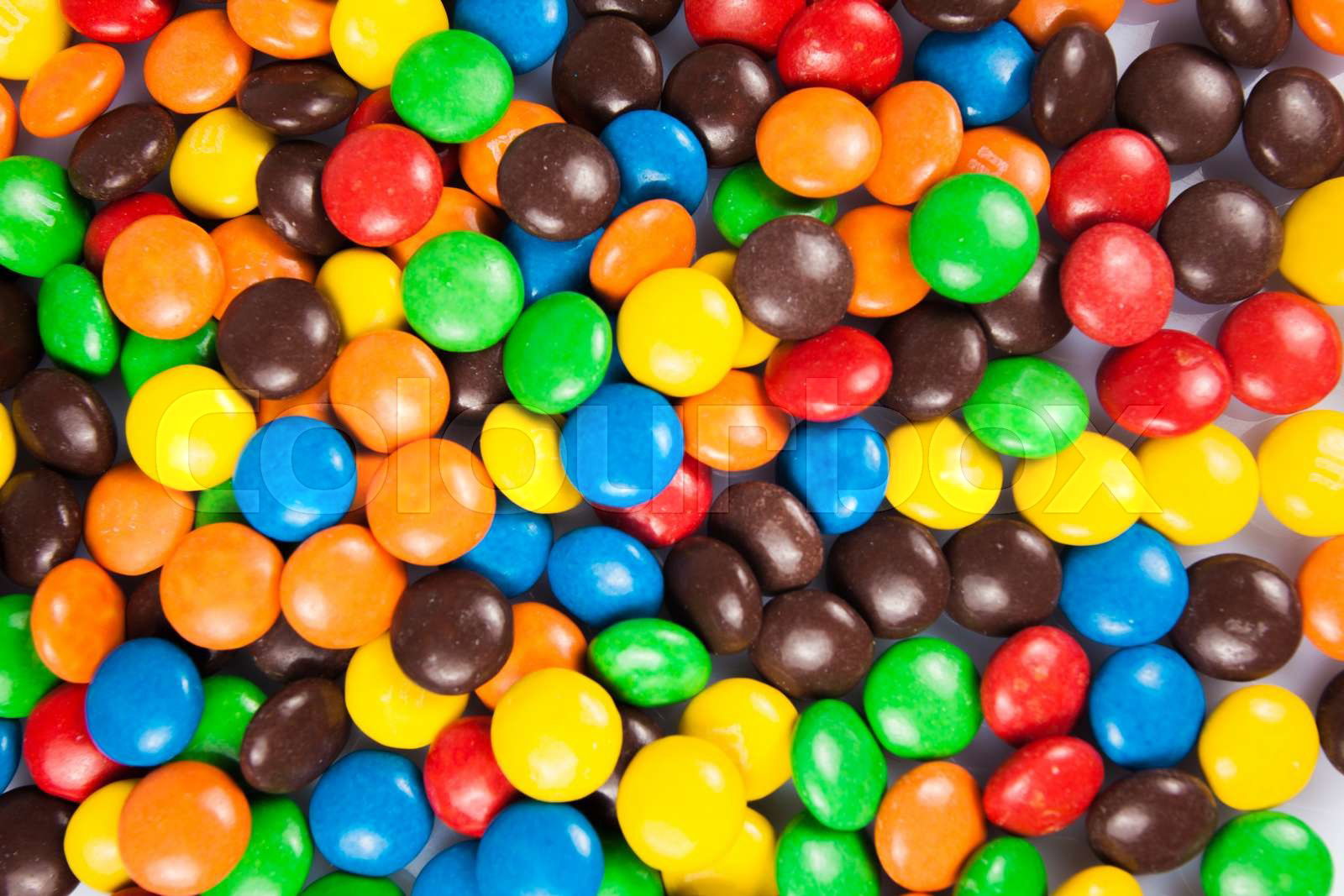 Close up of a pile of colorful chocolate coated candy colo Colourbox